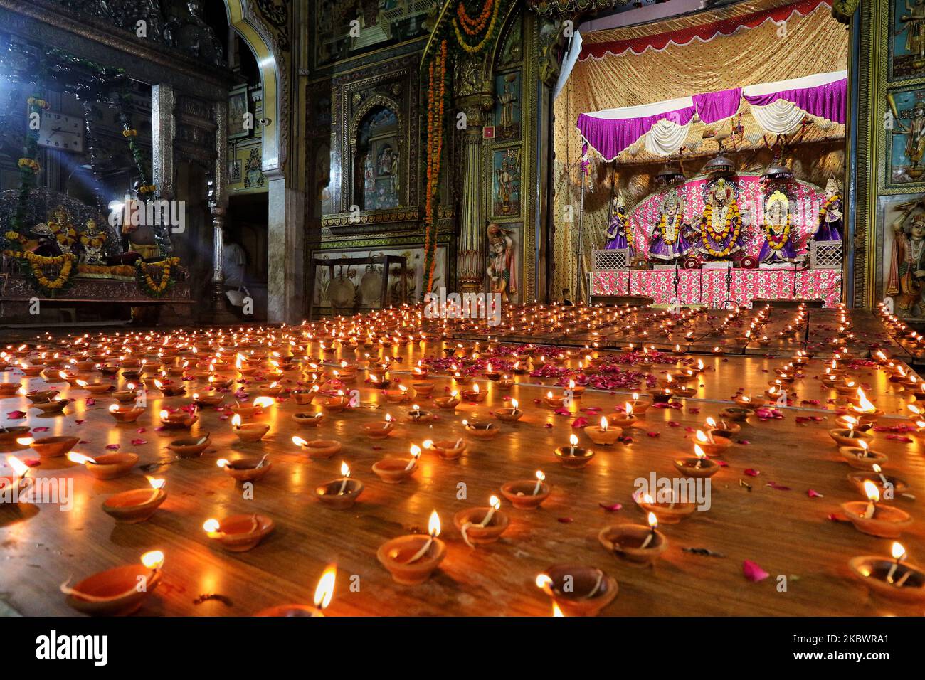 Hindu devotees light earthen lamps at Ramchandra Ji Temple to celebrate ...
