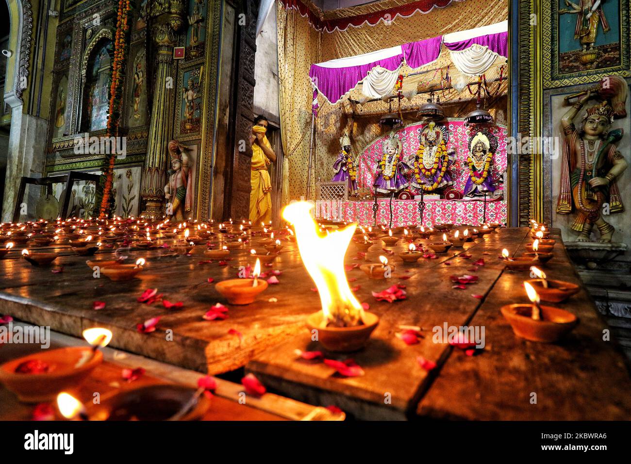 Hindu devotees light earthen lamps at Ramchandra Ji Temple to celebrate ...