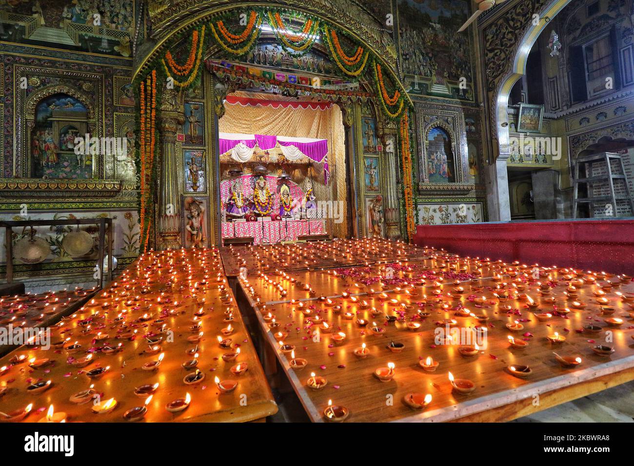 Hindu devotees light earthen lamps at Ramchandra Ji Temple to celebrate ...