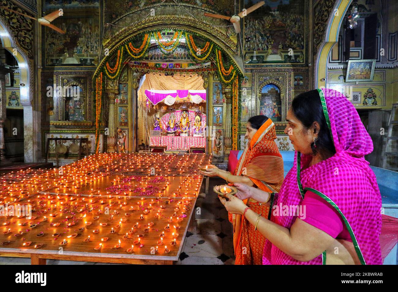 Hindu devotees light earthen lamps at Ramchandra Ji Temple to celebrate ...