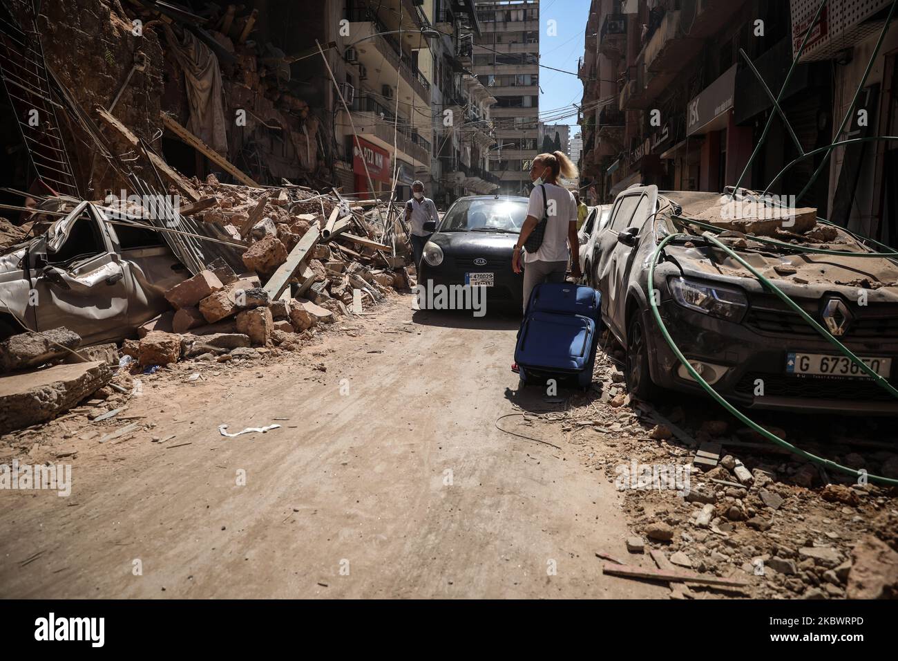 Damaged buildings are seen the day after a massive explosion at the ...