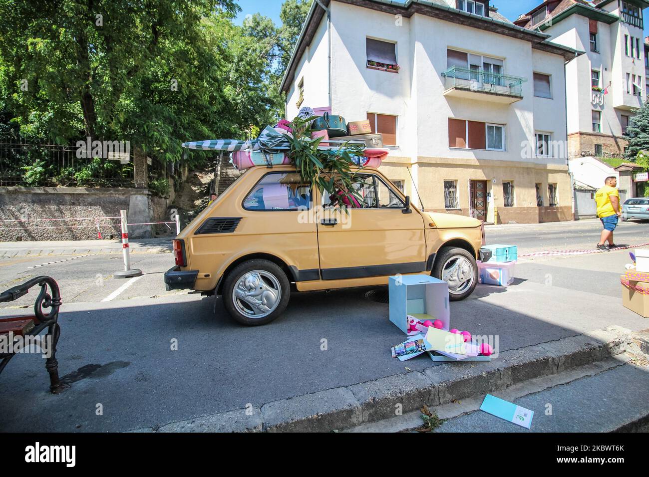 Polish yellow Fiat 126 p with a Mazda koala bear shaped wheel caps is ...