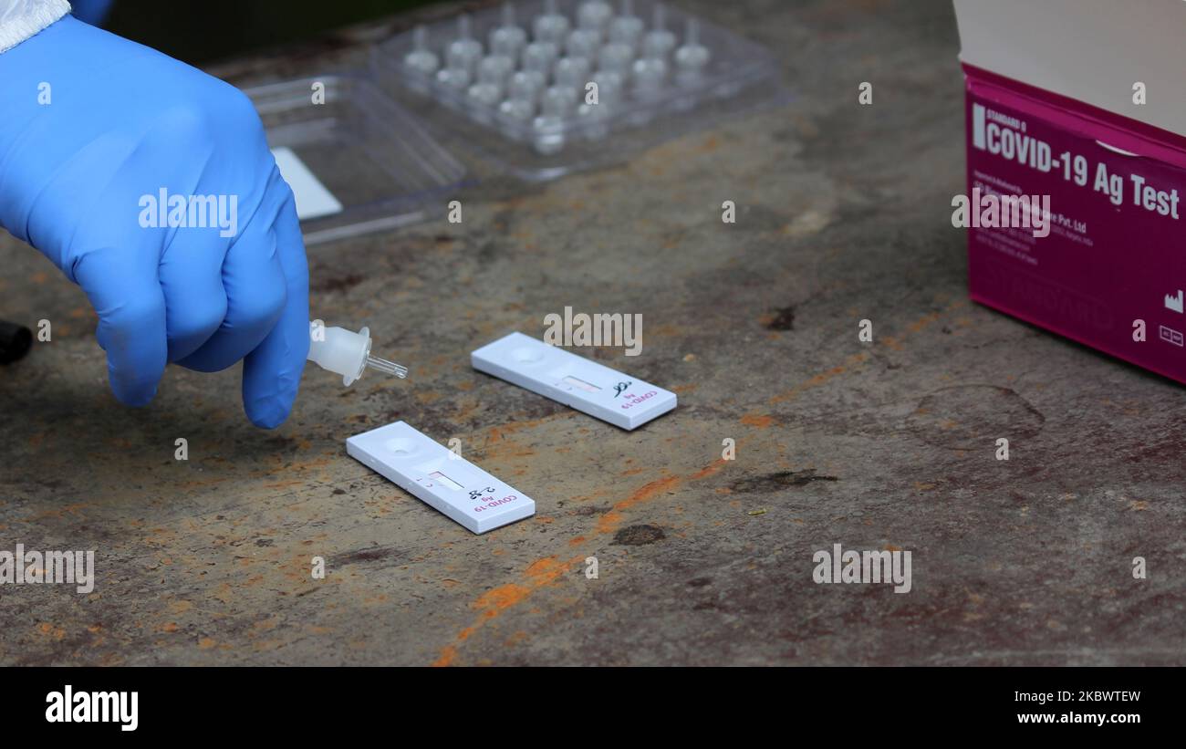 Testing kits are seen after collecting nasal swab samples from patients ...