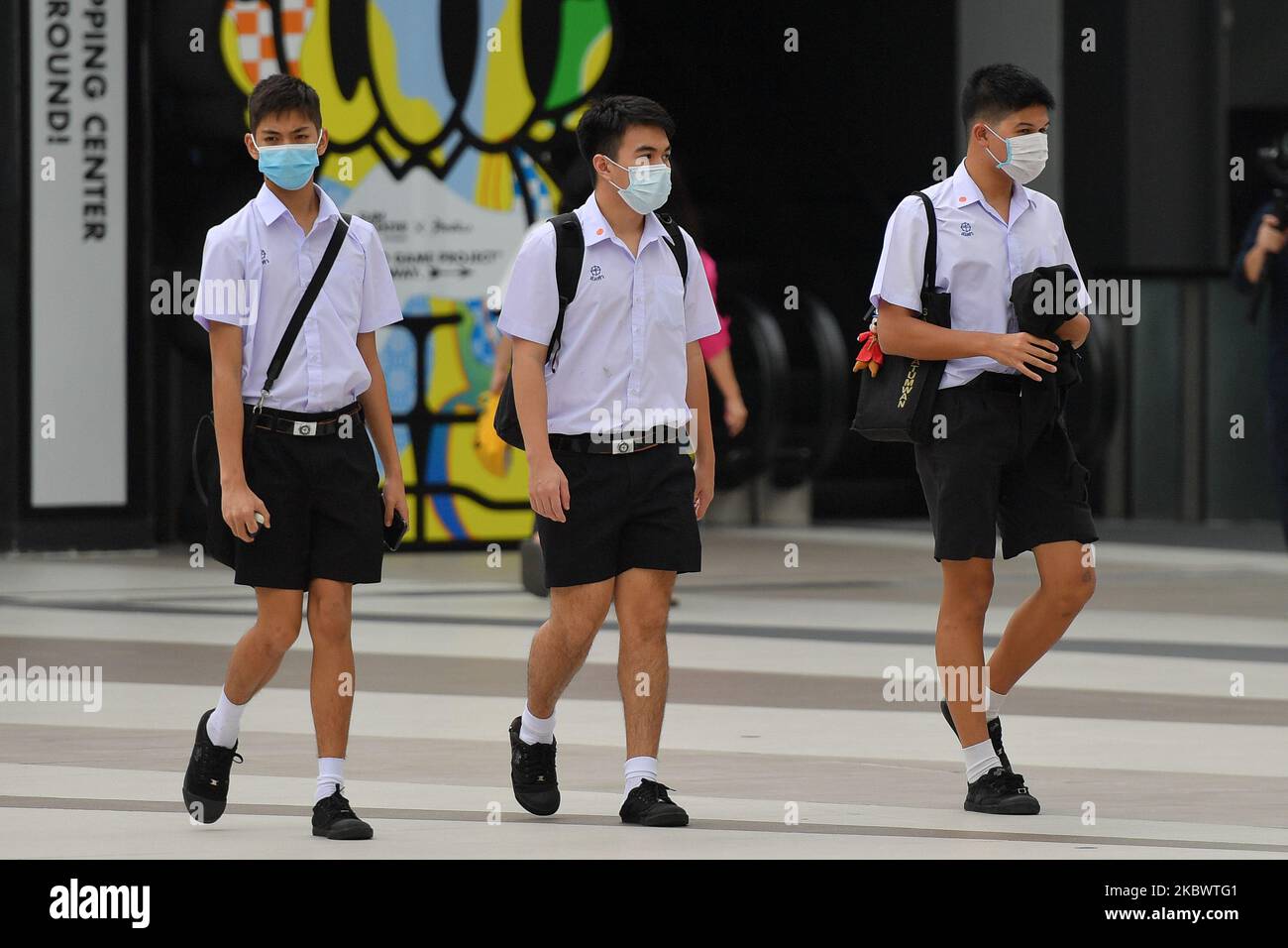 Pedestrians wearing face masks while walk past Siam Paragon shopping ...