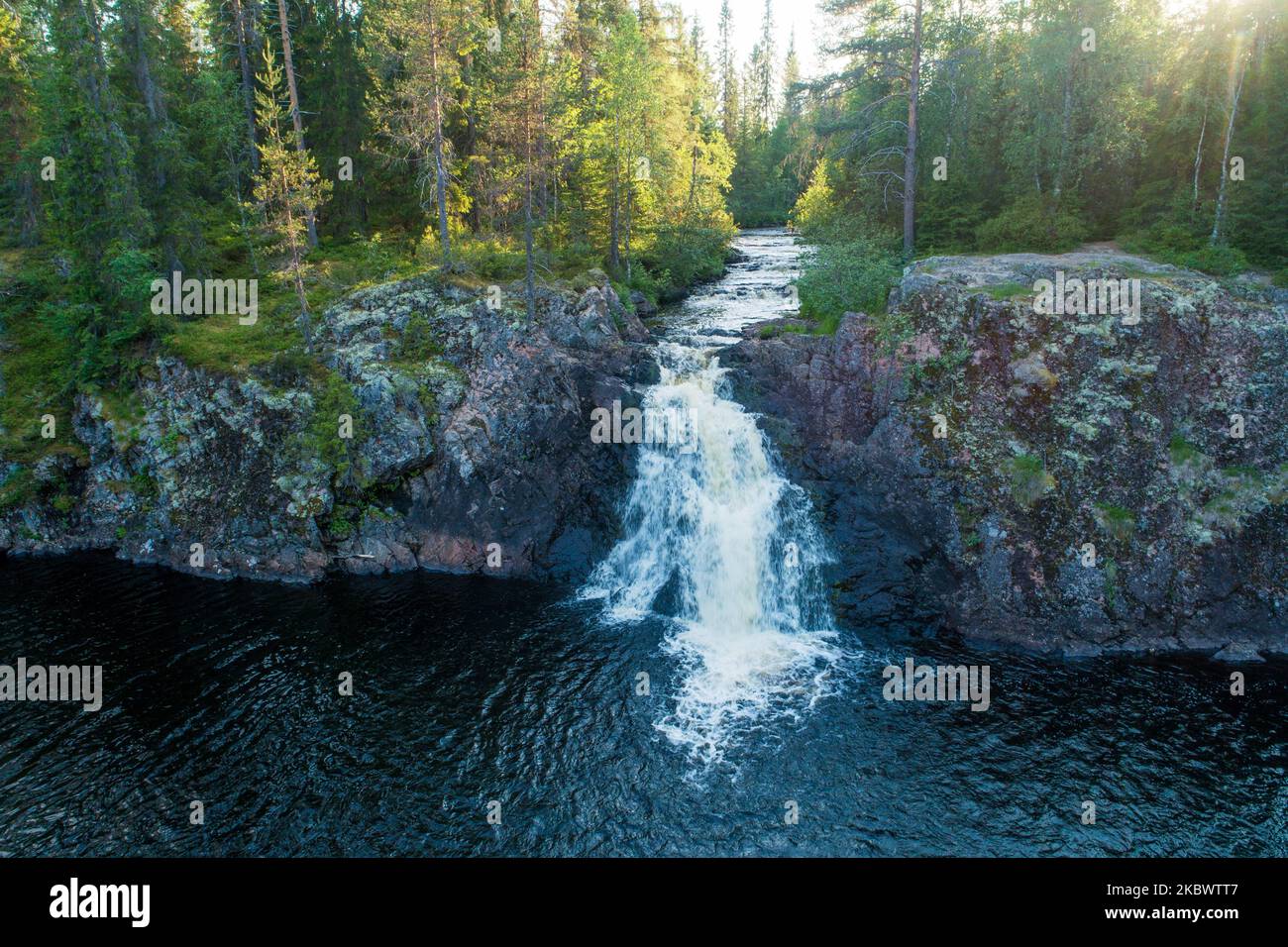 Beautiful Komulanköngäs waterfall on a summer evening. Shot near ...
