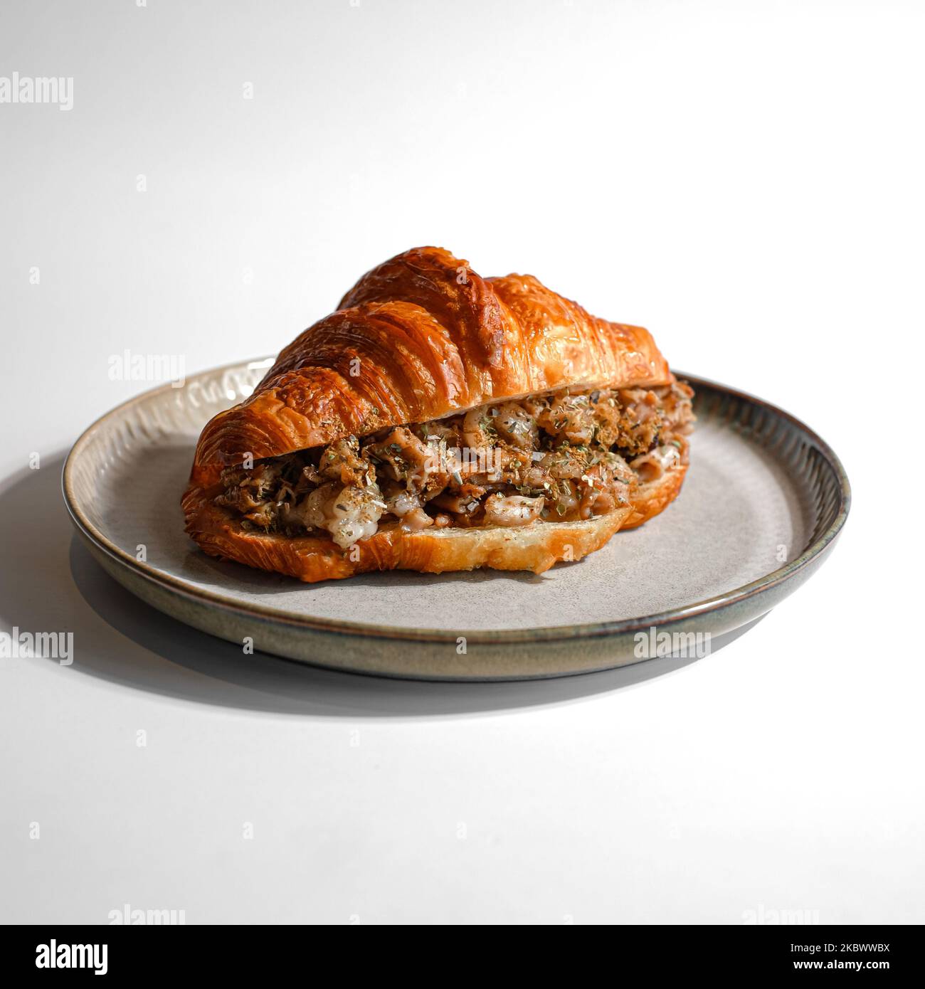 A delicious croissant with filling isolated on white background Stock ...