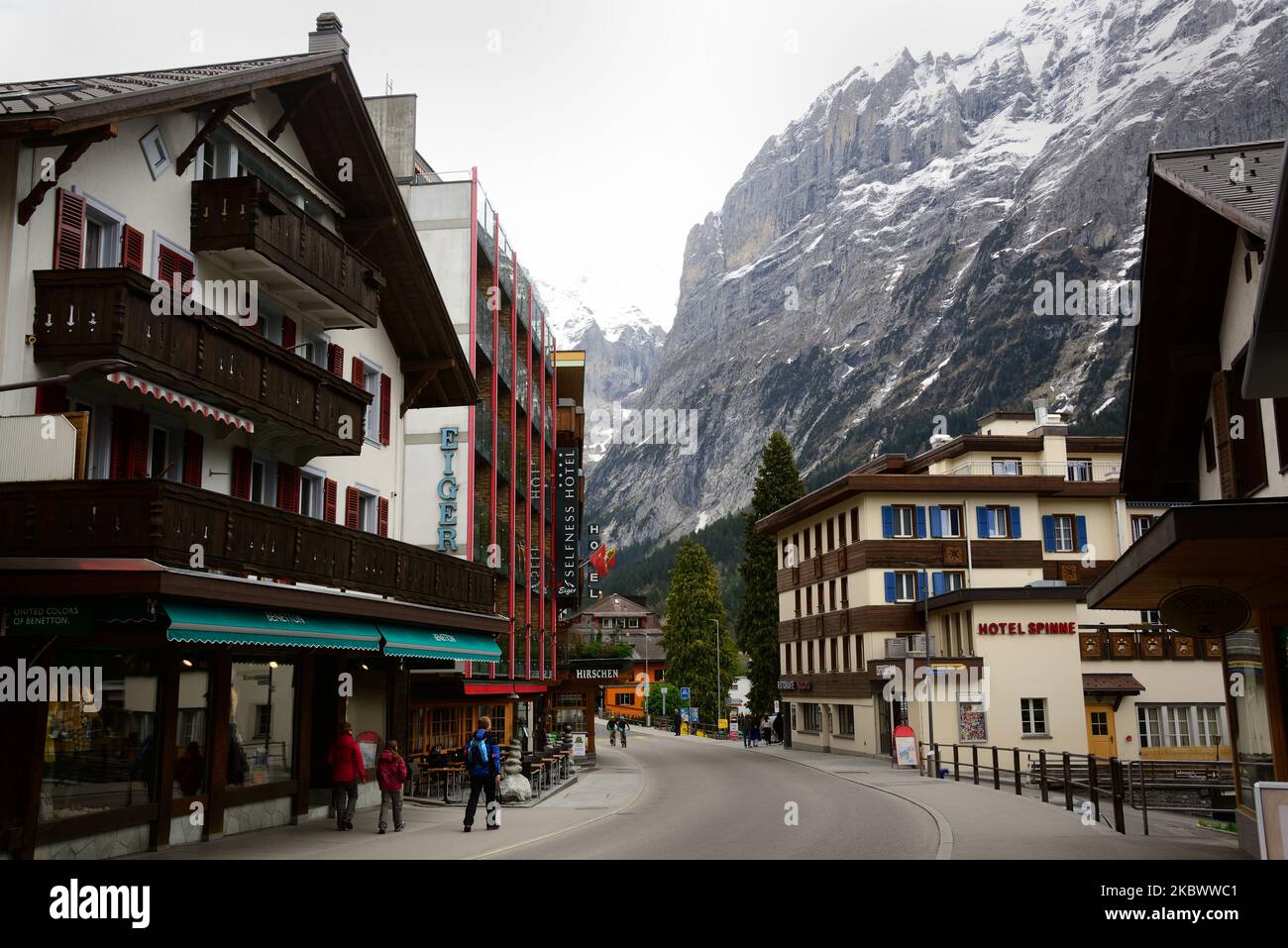 A scenic view of the main street in the town of Grindelwald with ...