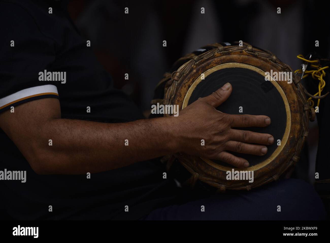 A Nepalese devotee play traditional instruments in the early morning at ...