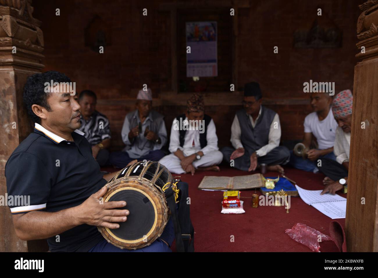 Nepalese devotees sing Bhajan and play traditional instruments in the ...