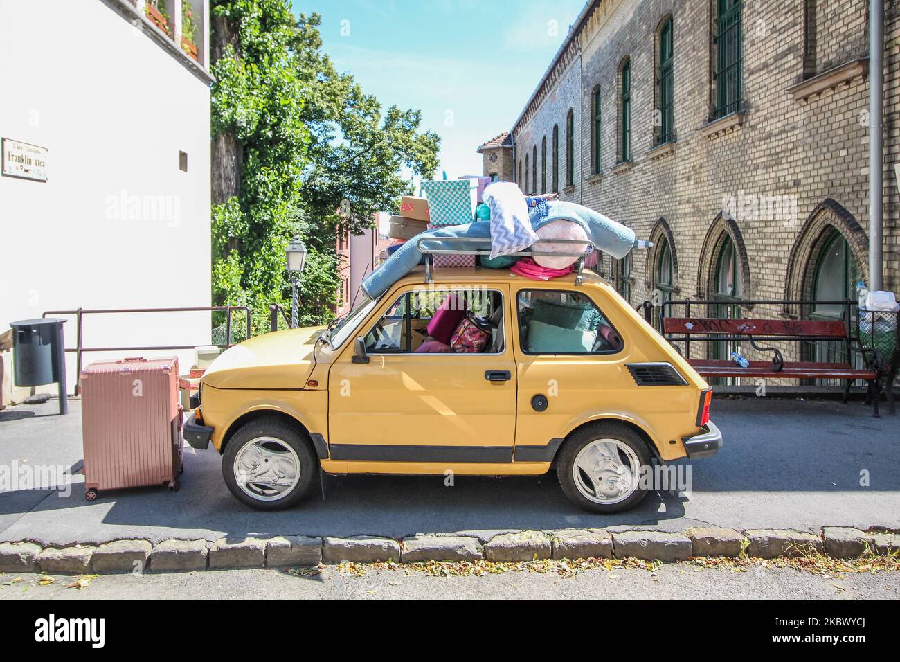 Polish yellow Fiat 126 p with a Mazda koala bear shaped wheel caps is ...