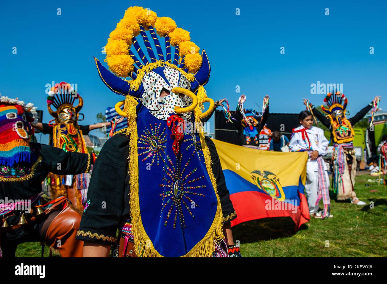 People are carrying out a Bolivian traditional dance wearing ...