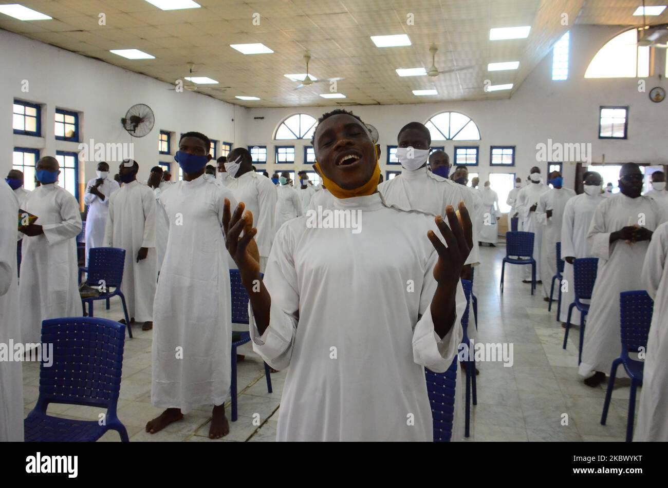 Worshippers wearing facemask pray as worship centers reopen after the ...