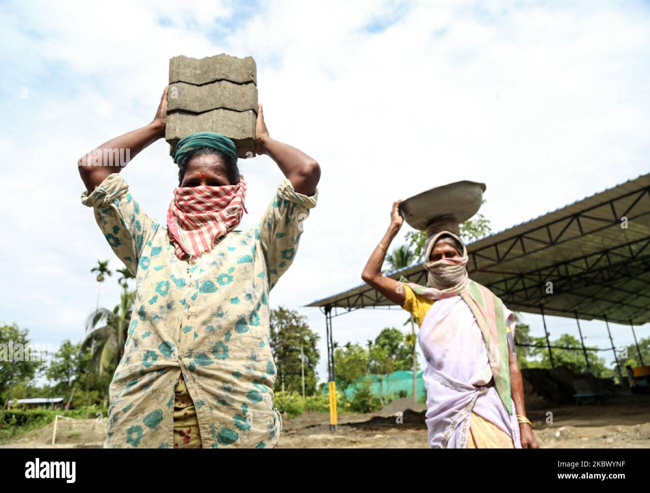 Women workers in Assam, India on August 7, 2020 continues their field ...