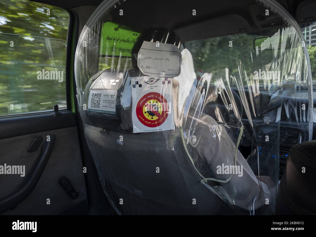 An Iranian driver drives his vehicle along an expressway in northern ...