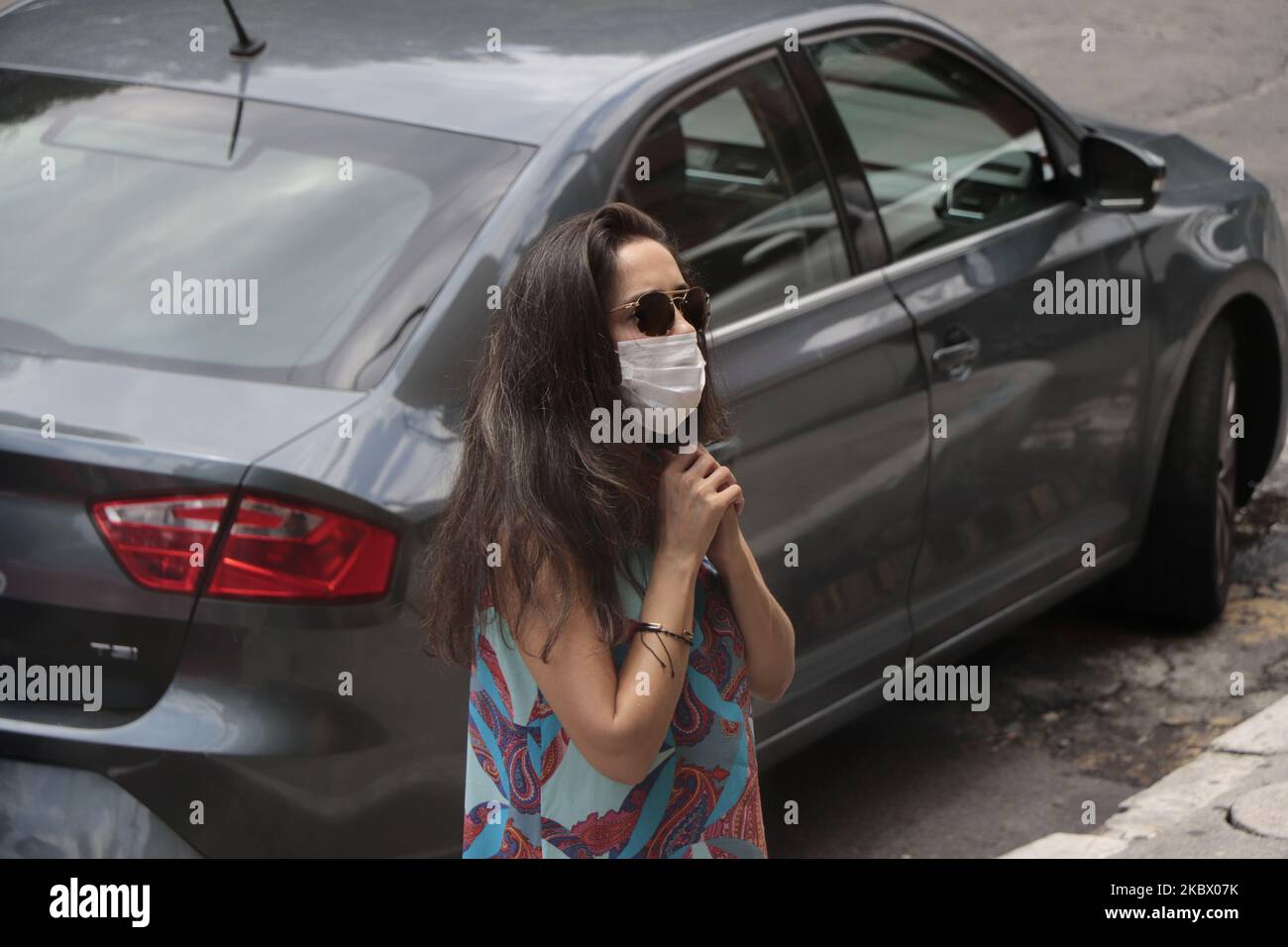 A woman from the Lebanese community in Mexico prays outside the Parish ...
