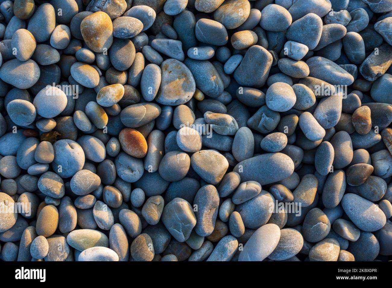 Round pebbles on a beach near Cape Agulhas. L'Agulhas in the Overberg ...