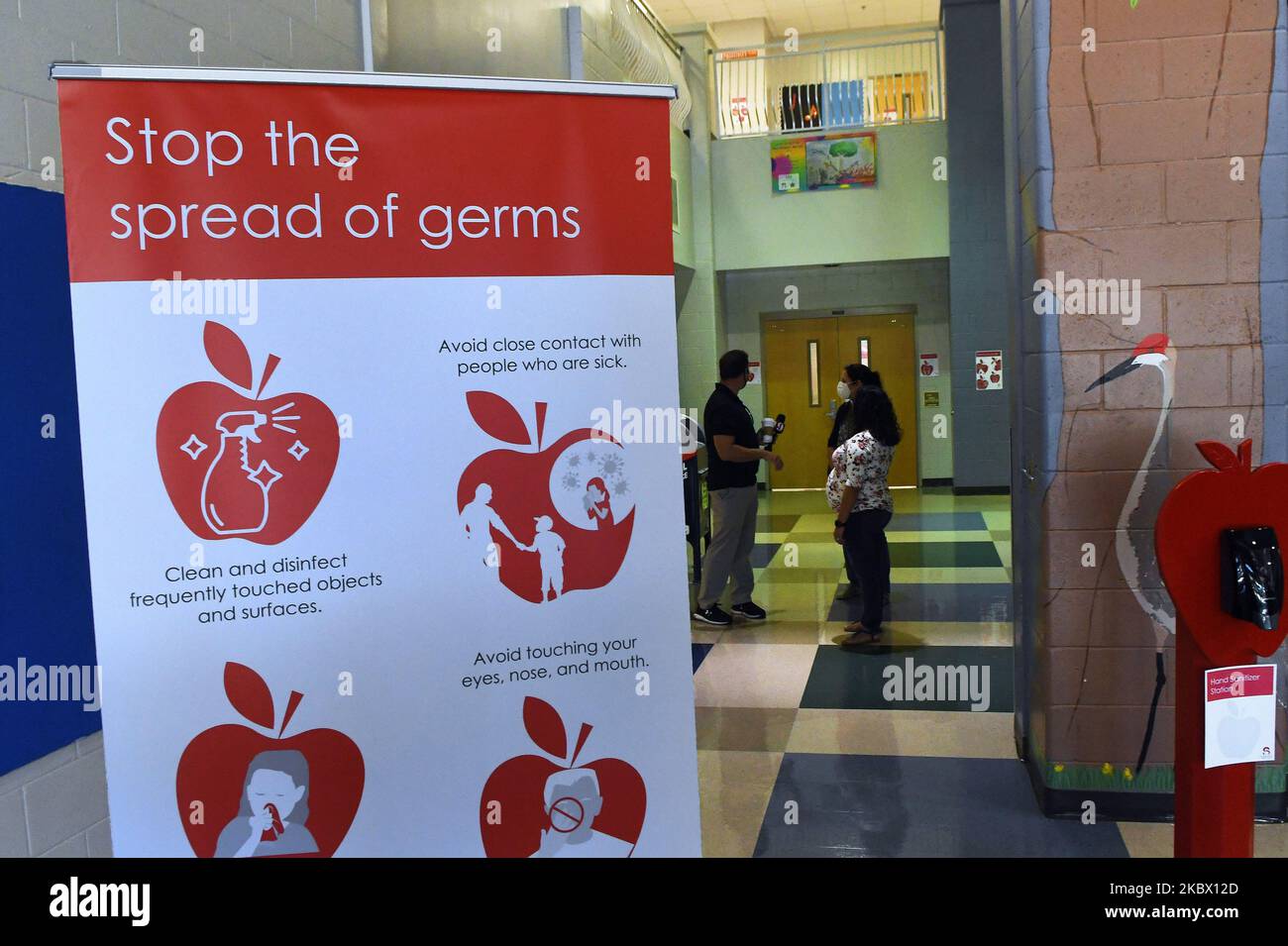 Heath safety precautions are seen posted in the lobby at Layer ...