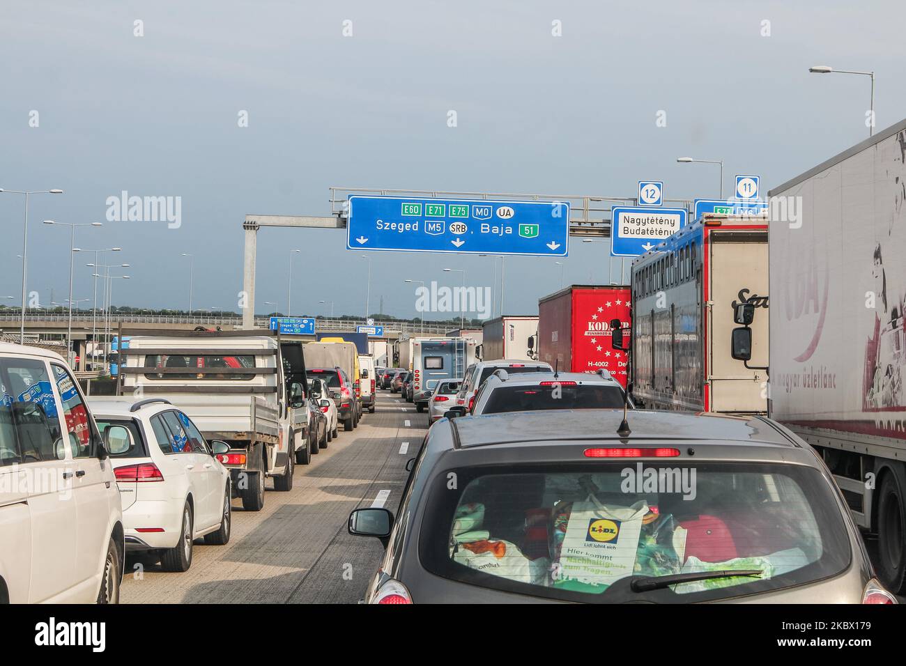 Trucks, cars, campers, and caravans standing in giant traffic jam due ...