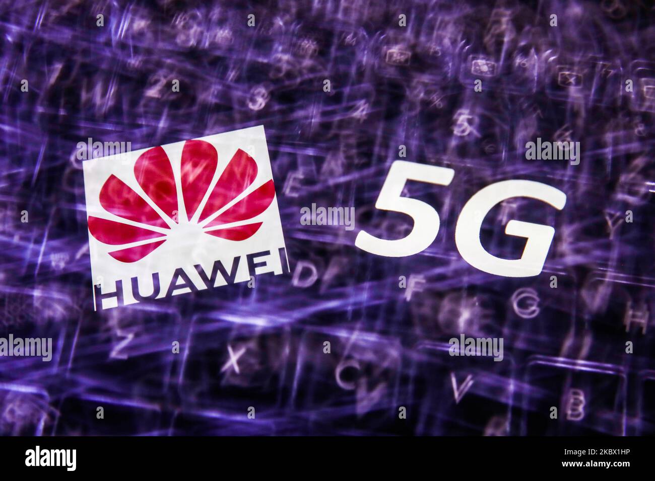 Huawei logo and 5G sign displayed on a smartphone screen and a keyboard ...