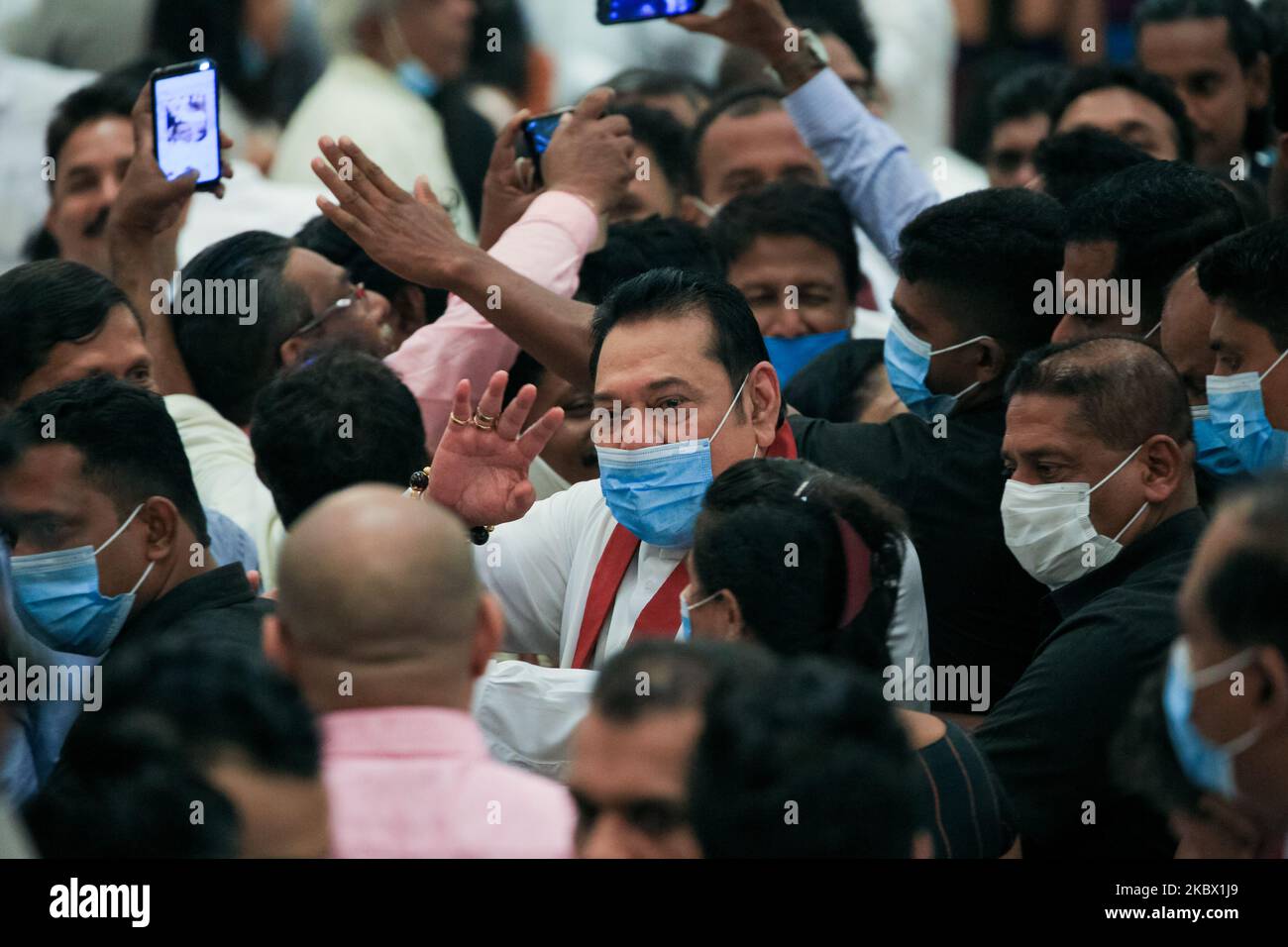 Sri Lankan prime minister Mahinda Rajapaksa, wearing a face mask ...