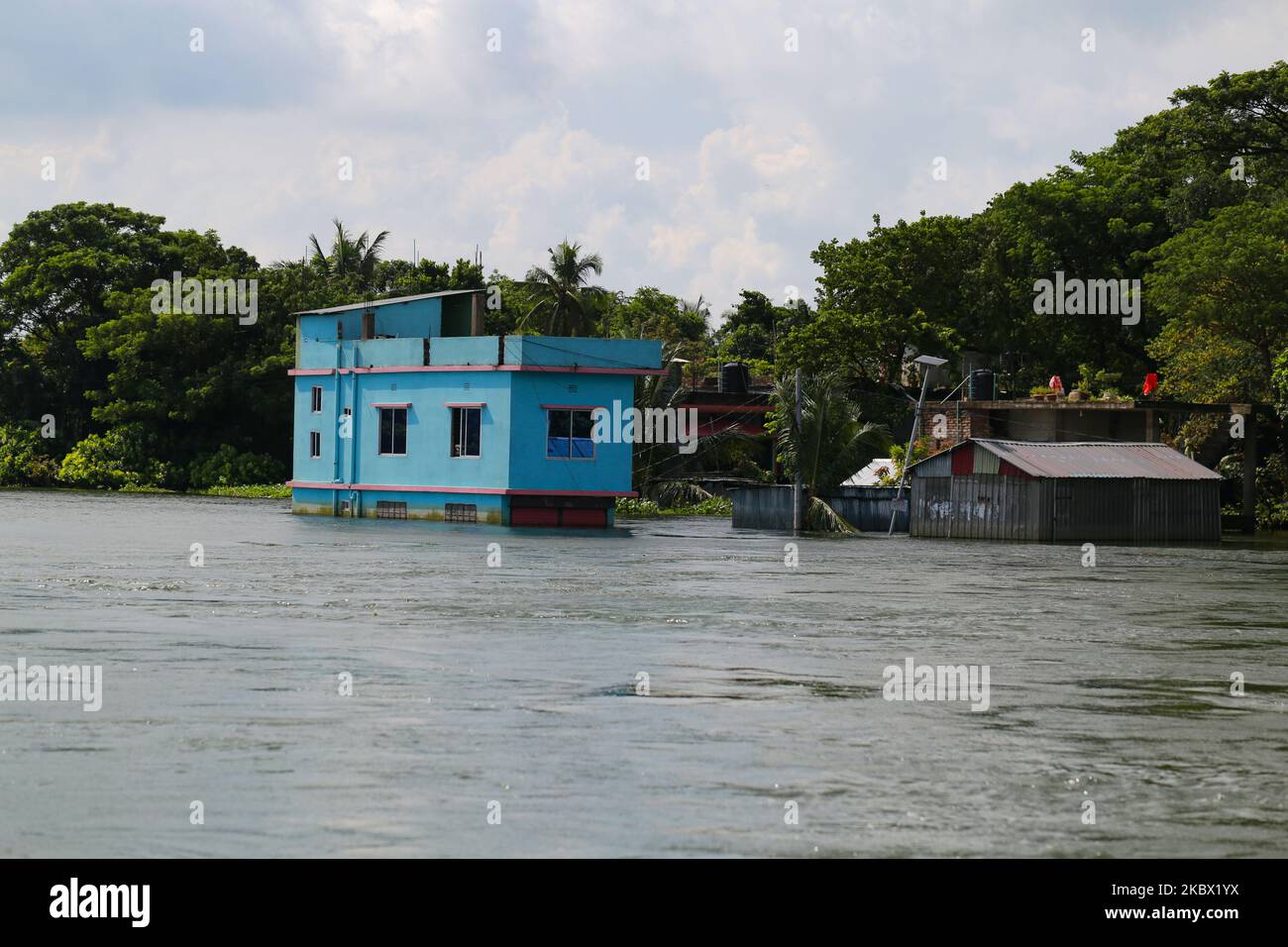 Submerged houses seen at a flooded area at Dhamrai in Dhaka, Bangladesh ...