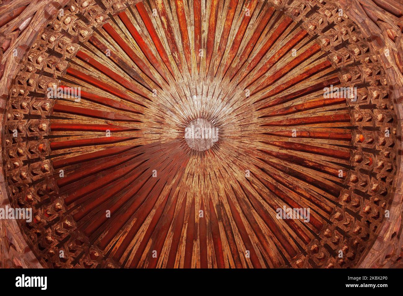 A low-angle closeup of a beautiful wooden ceiling in an old Moroccan ...