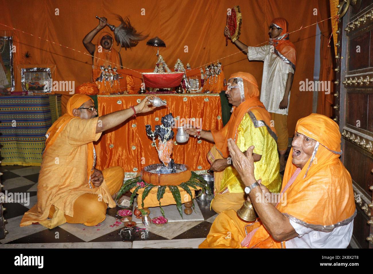 Priests perform Panch Amrit Abhishek on Lord Krishna idol at Ladli Ji ...