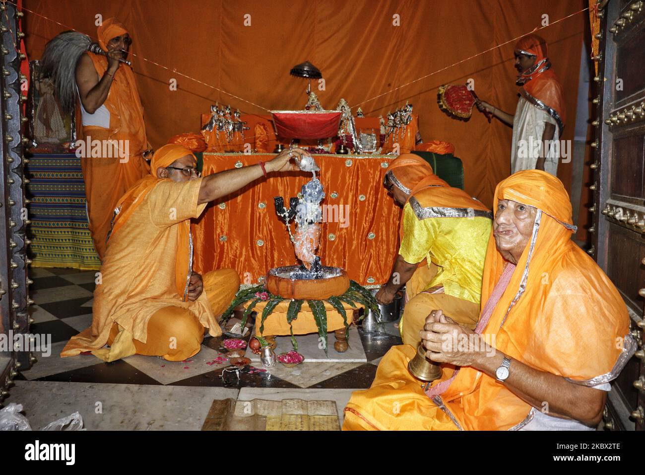 Priests perform Panch Amrit Abhishek on Lord Krishna idol at Ladli Ji ...