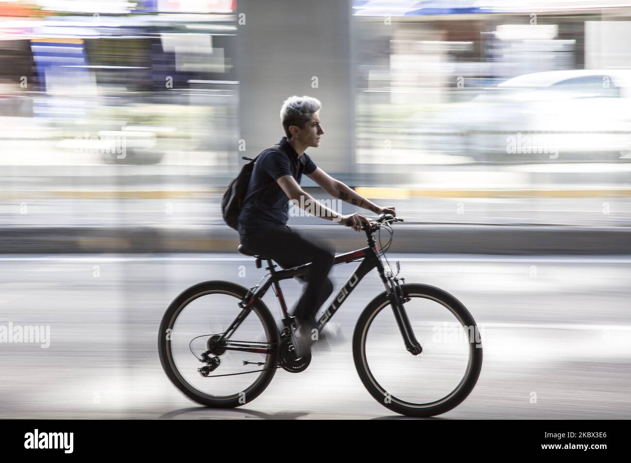 A Turkish girl ride her bicycle amid continuing worries over the new ...