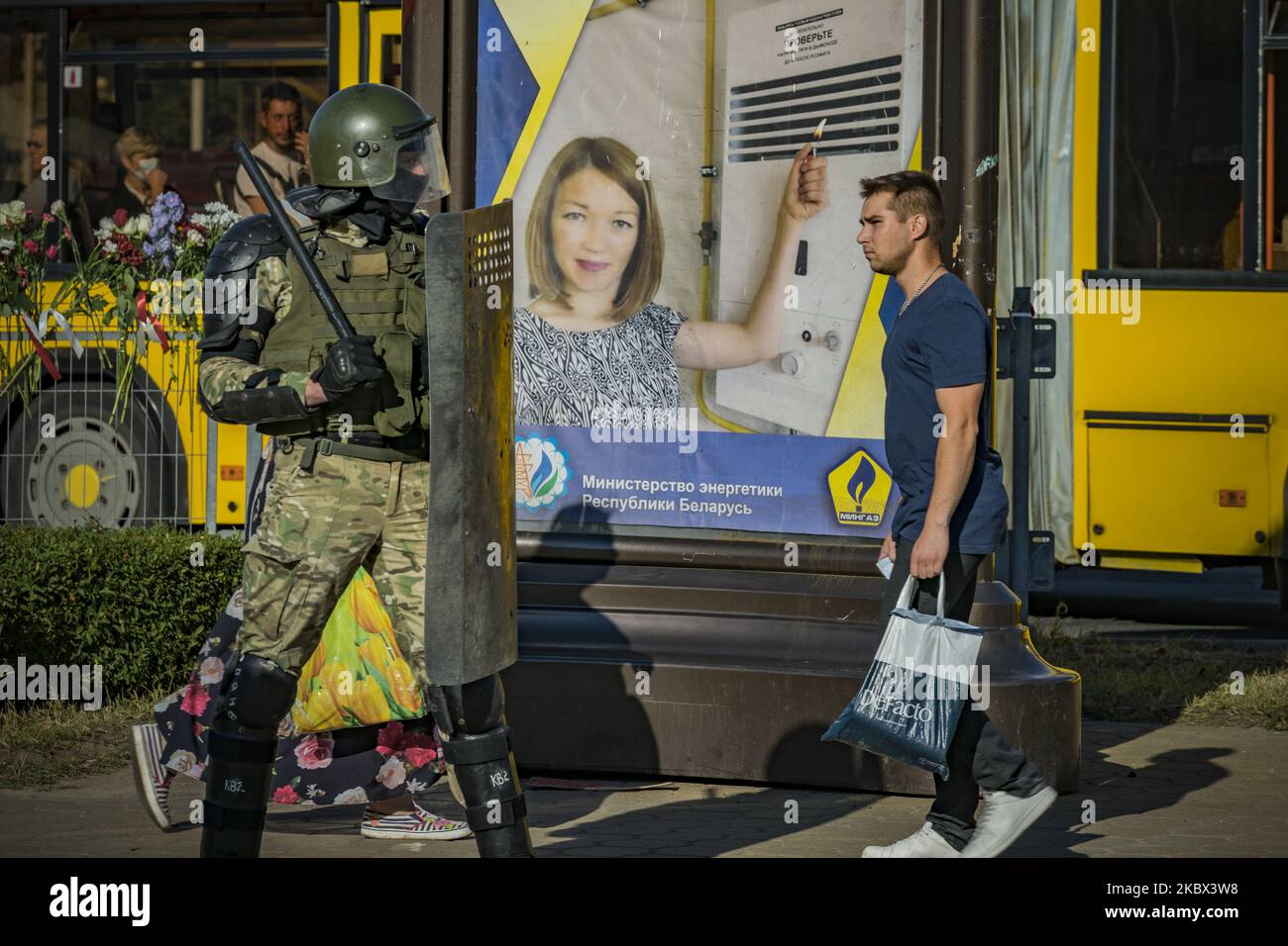A man looks at a riot policeman in the streets of Minsk, Belarus, on ...