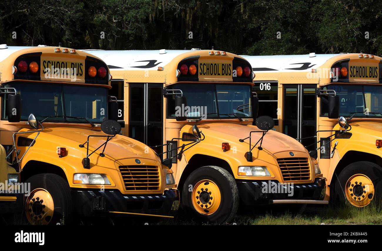 School buses are seen parked at the Winter Springs Transportation Hub ...