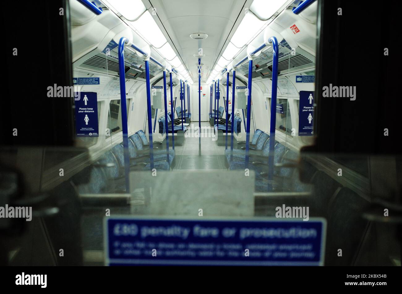 An empty tube carriage rides along the Northern line in London, England ...