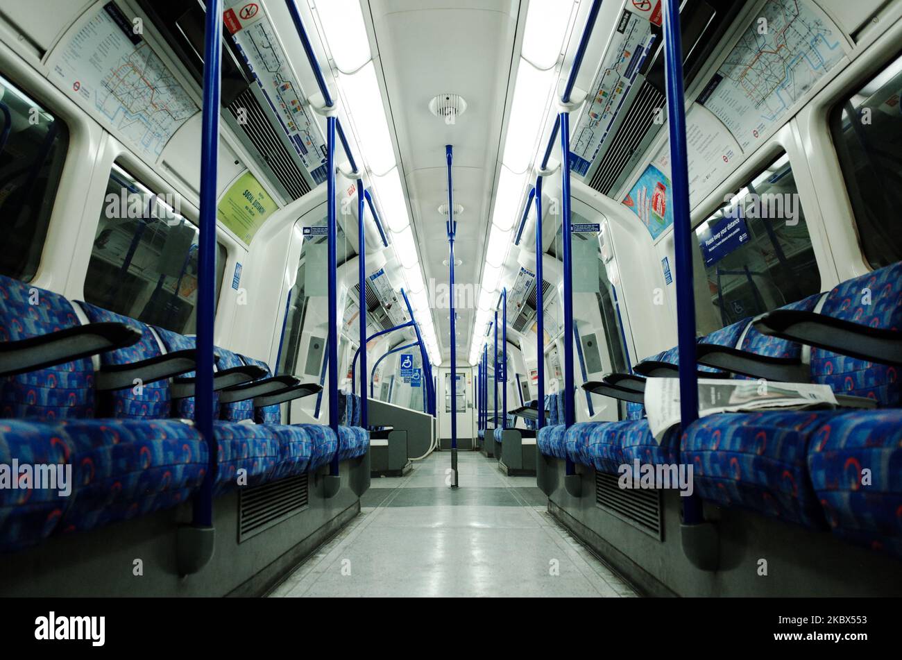 An empty tube carriage rides along the Northern line in London, England ...