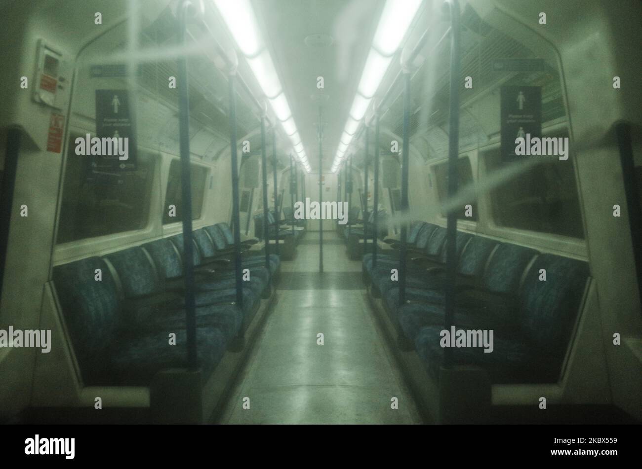 An empty tube carriage rides along the Northern line in London, England ...