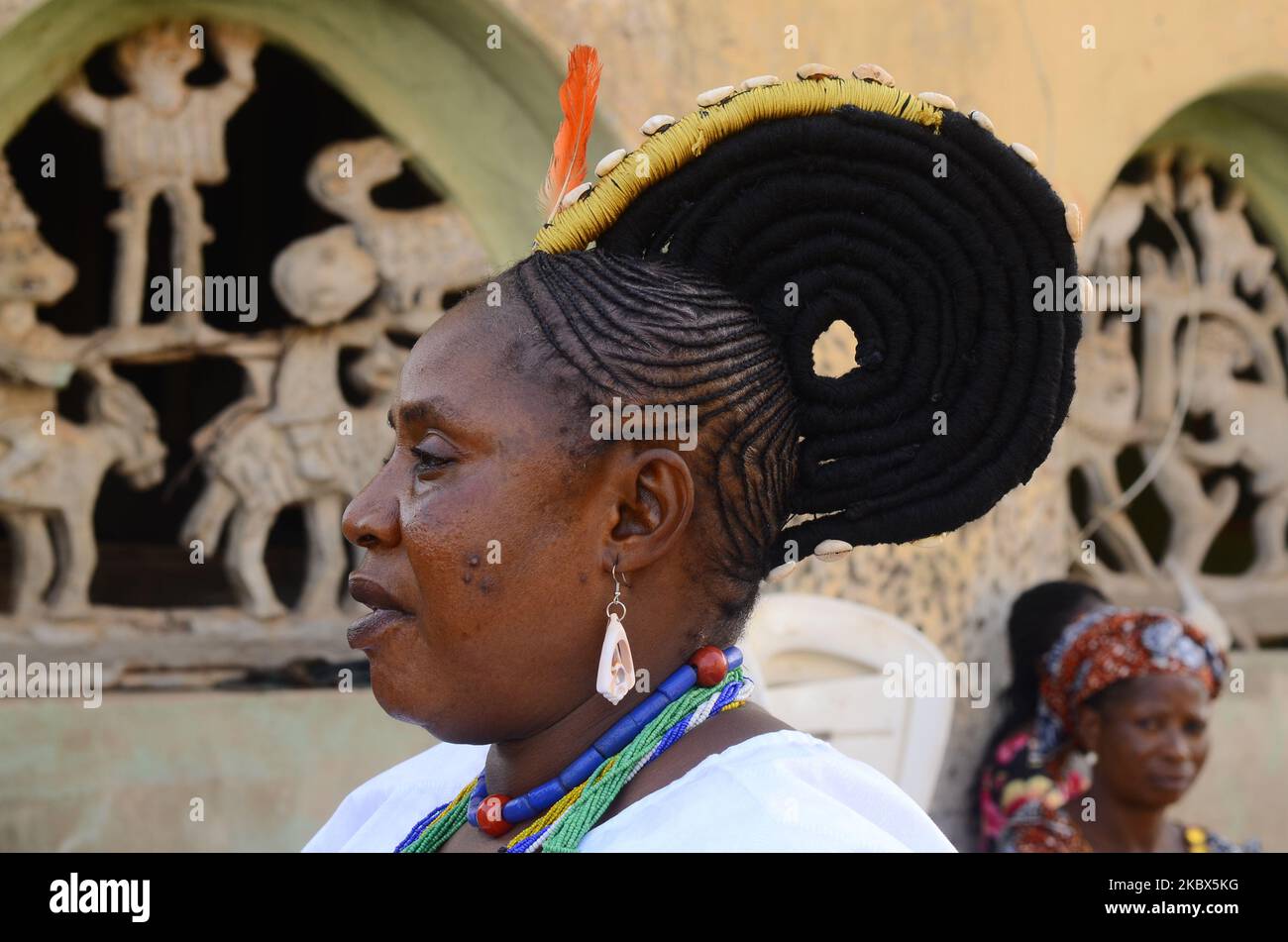 A devotee of river goddess Osun pose for photograph during the annual ...
