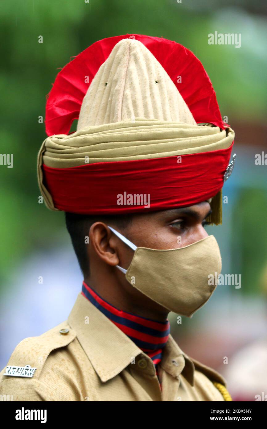 Indian Police personnel wearing face masks march during an Independence ...