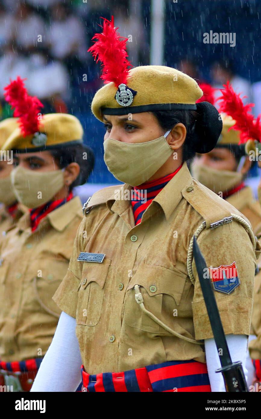 Indian Police personnel wearing face masks march during an Independence ...