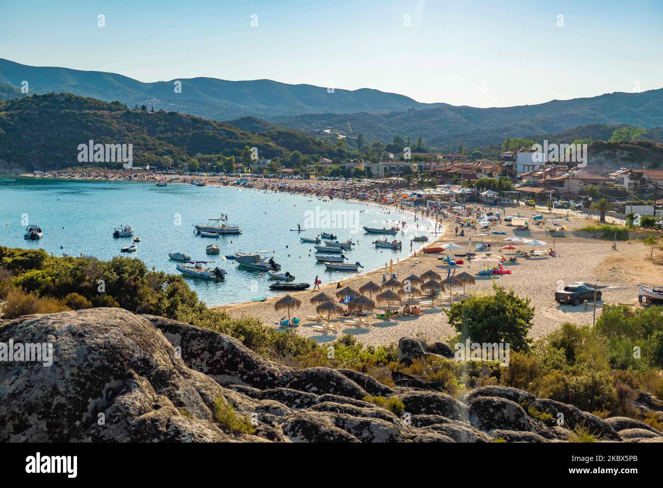 Panoramic view of Kalamitsi beach. Crowd of tourists at the popular and ...