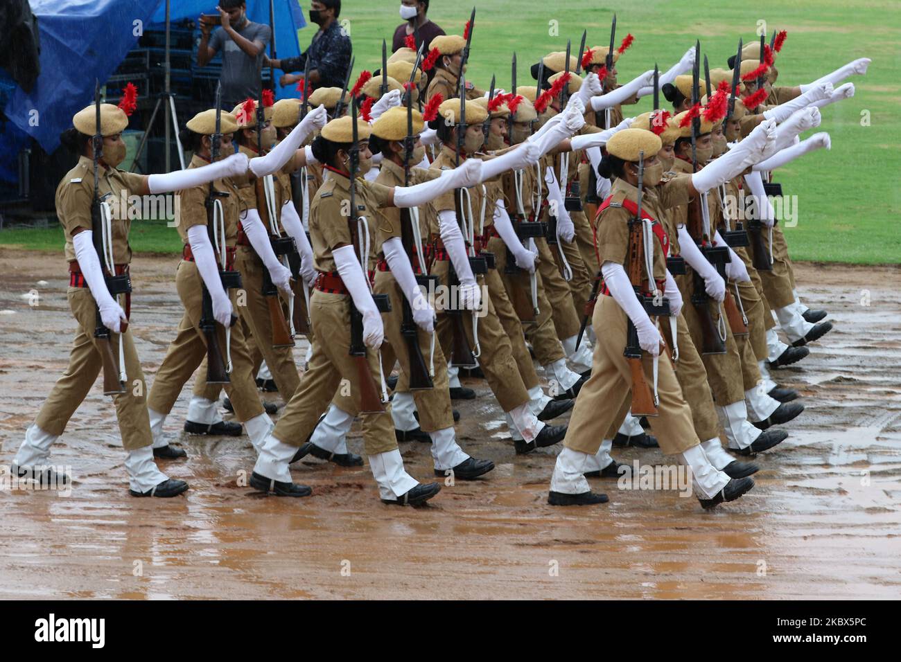 Indian Police personnel wearing face masks march during an Independence ...