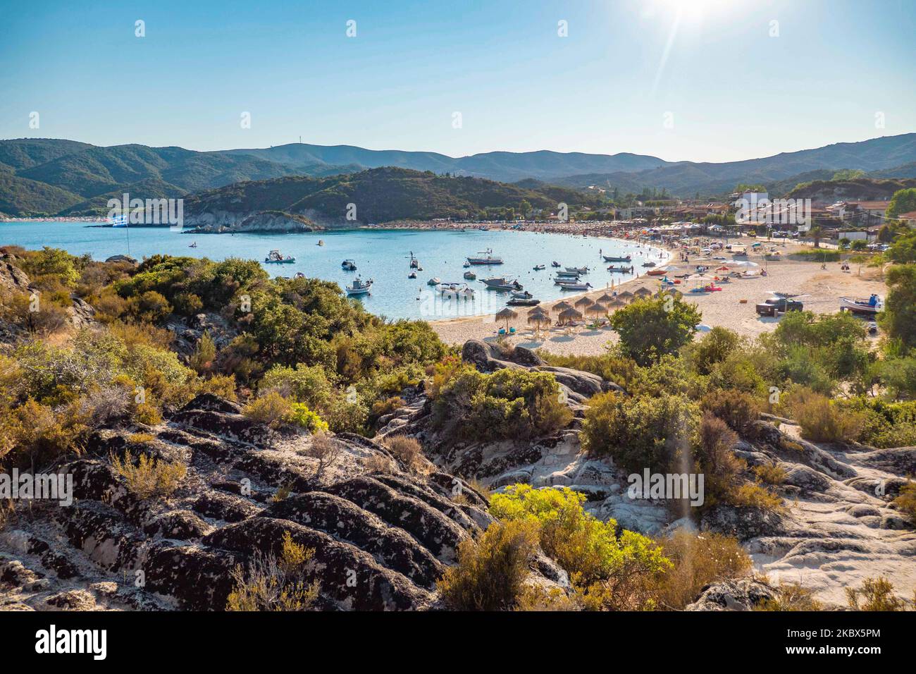 Panoramic view of Kalamitsi beach. Crowd of tourists at the popular and ...