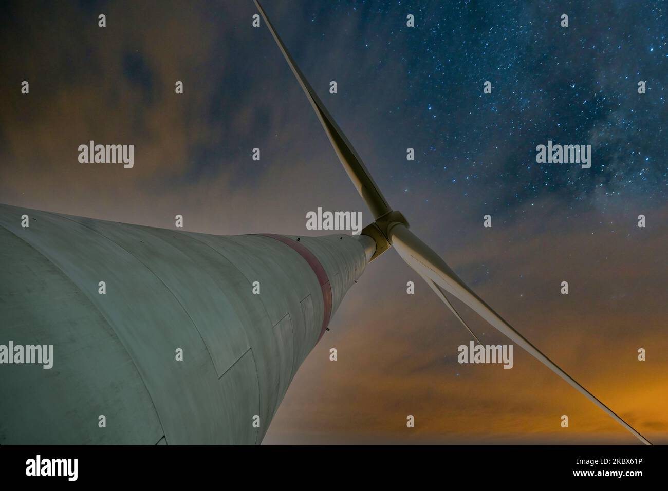 A low-angle shot of a wind power turbine for renewable energy on a ...