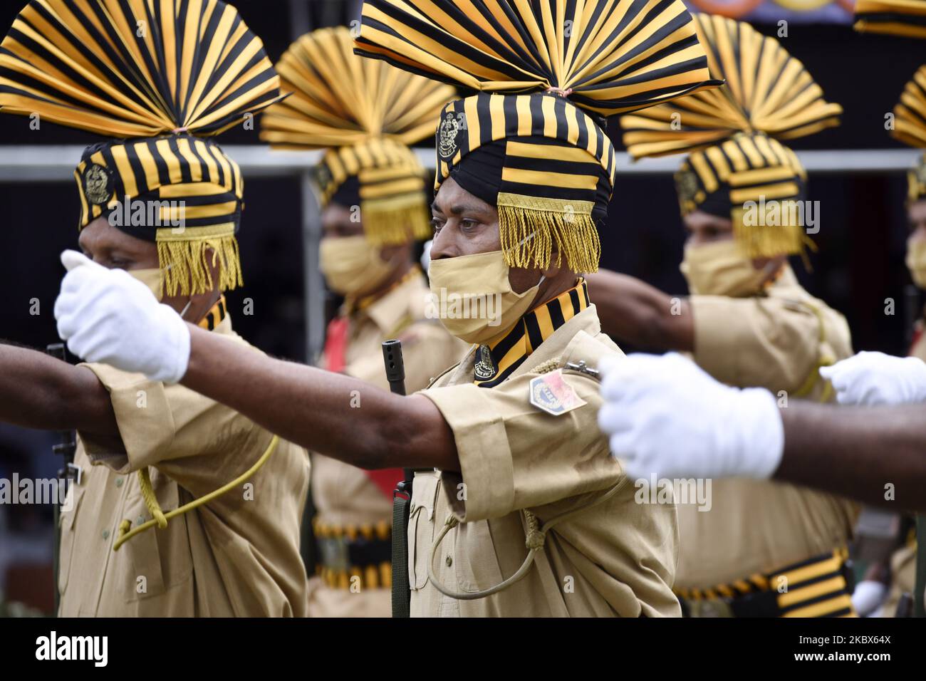 Indian paramilitary soldiers wearing mask participate in the parade for ...