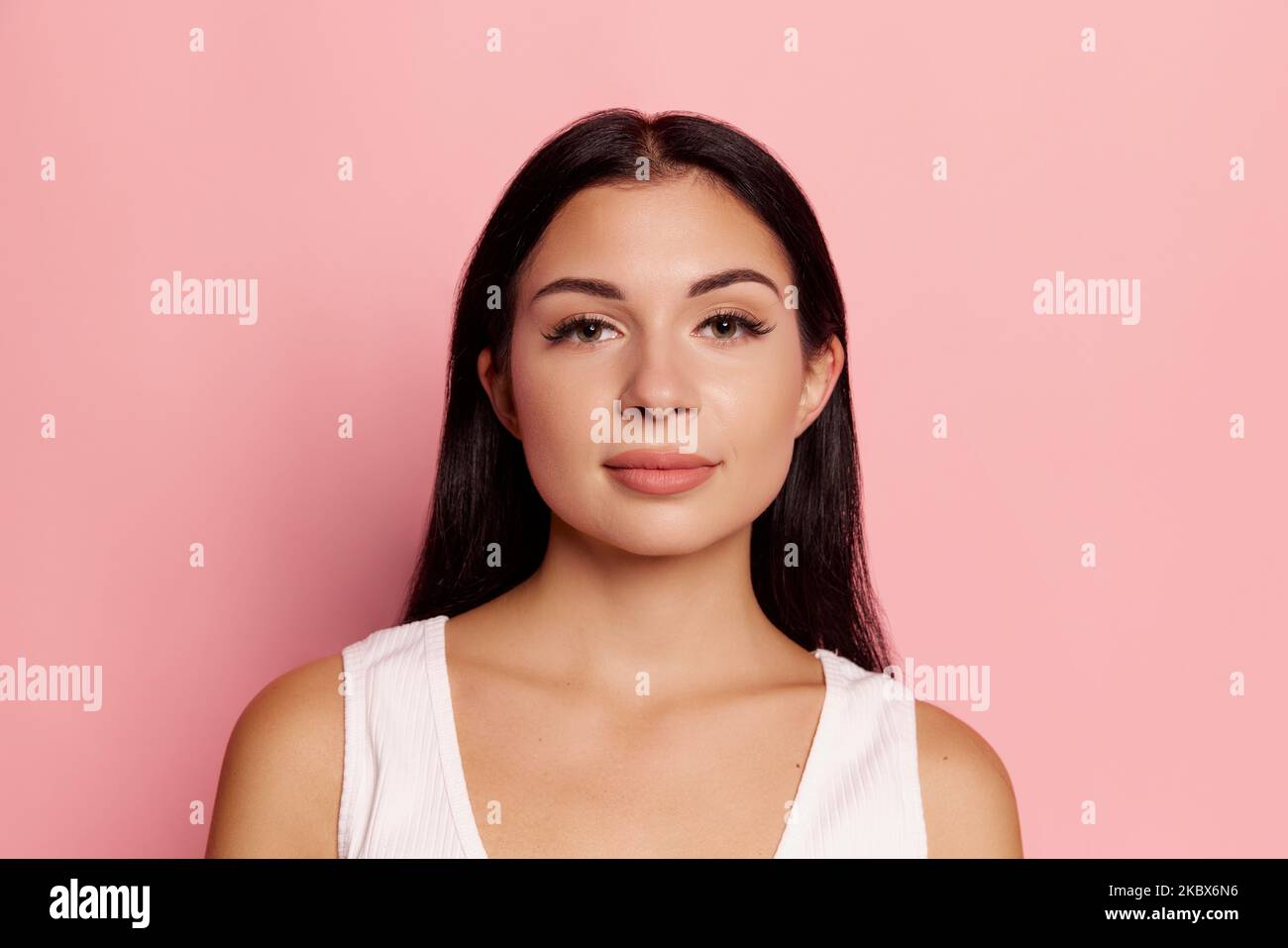 I am ok. Happy smiling woman isolated on trendy pink studio background ...