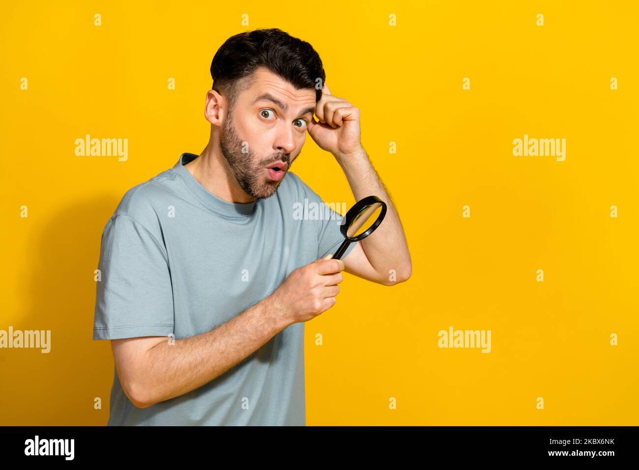 Photo of impressed man wear trendy outfit using magnifying glass ...