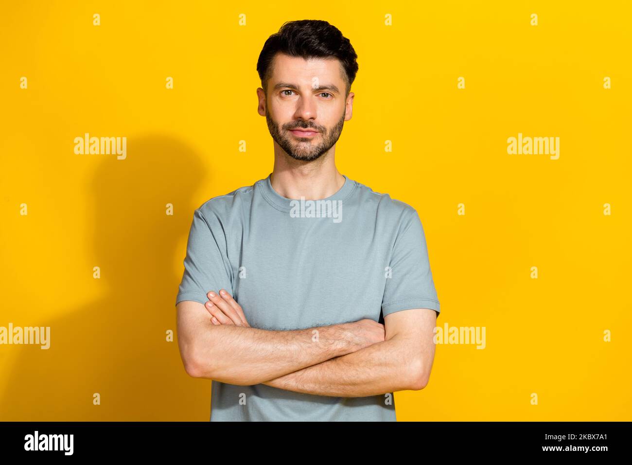 Photo of serious man gentleman satisfied nice haircut arm folded ...