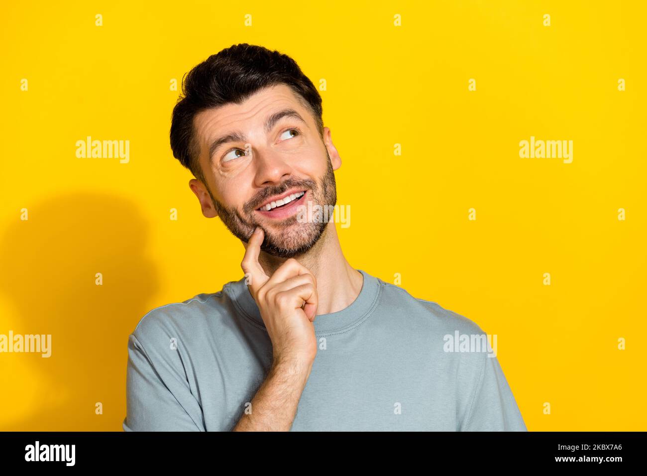 Closeup photo of young funny positive cute dreamy bearded man touch ...