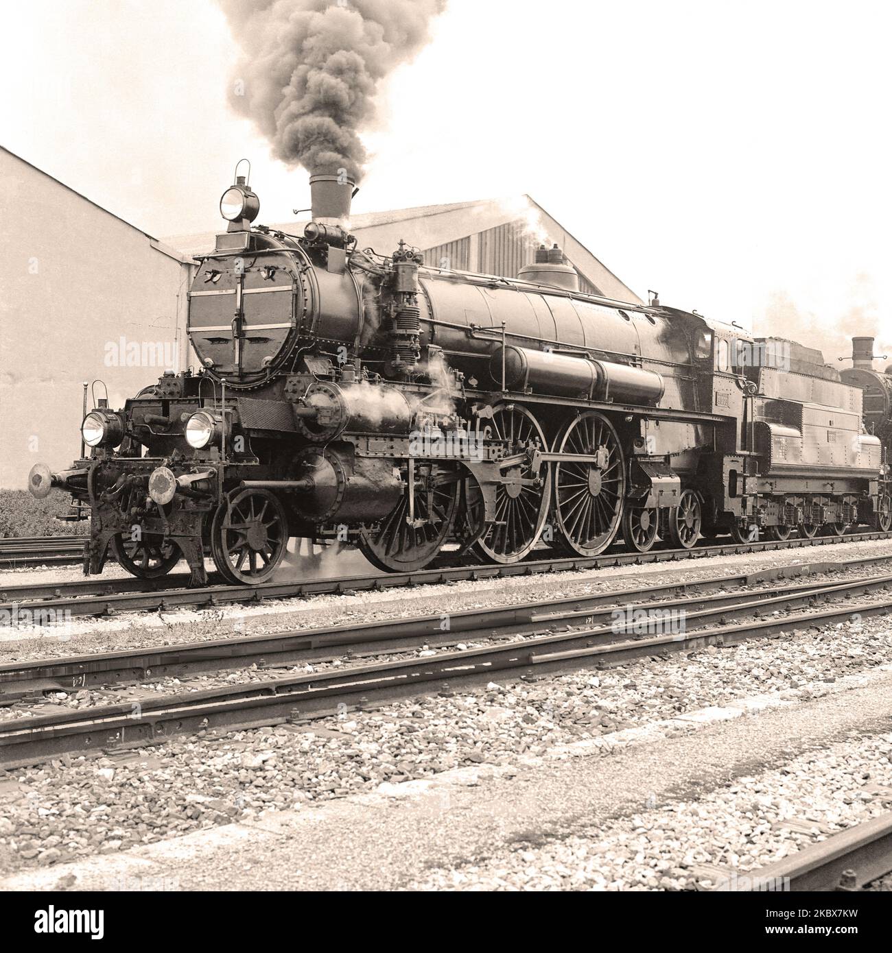 Side view of an old-fashioned steam locomotive in an austrian railway ...