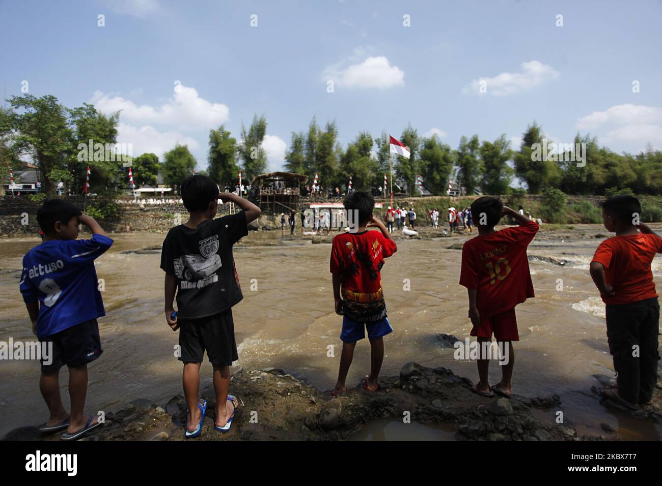 Indonesian children conduct flag raising ceremony at Ciliwung rivers ...