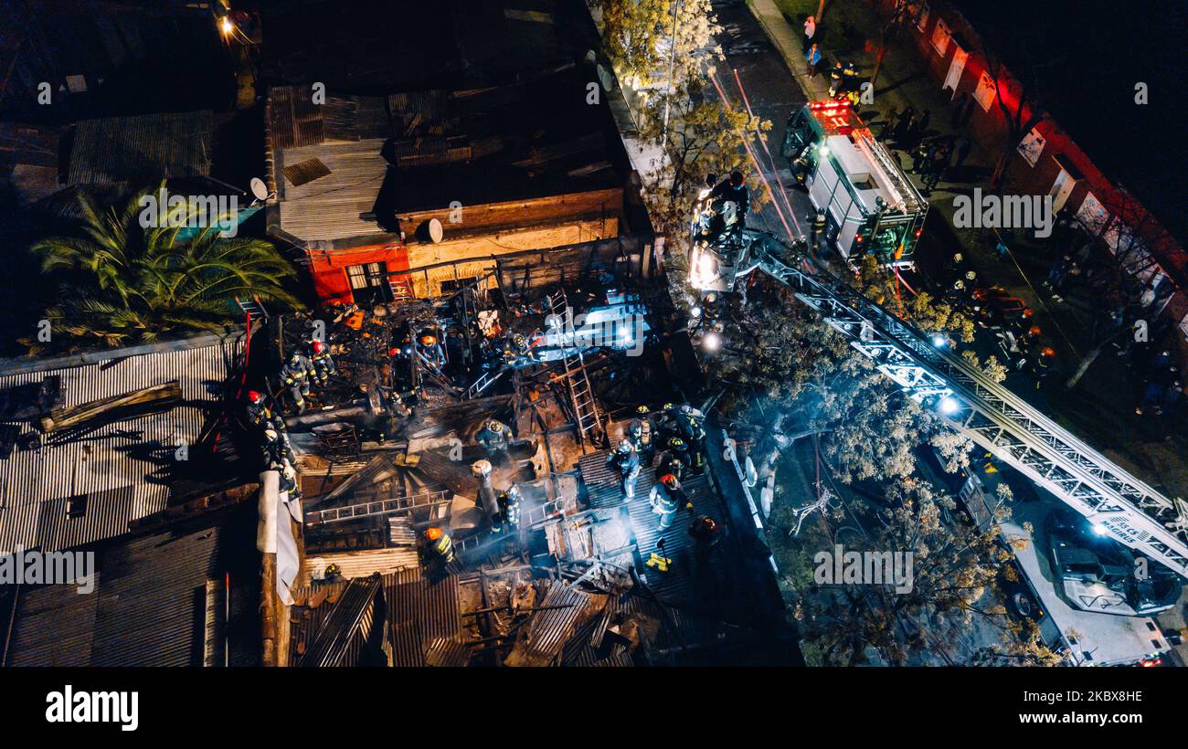 Drone view of a fire in *cite in downtown Santiago, more than 15 fire ...