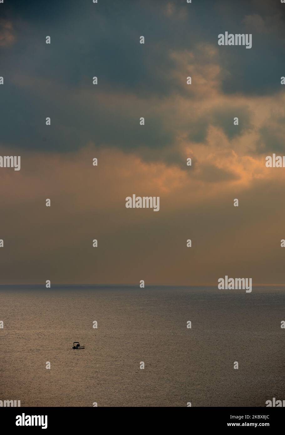 Sunrise in the sea with cloud stormy clouds and orange colour. Seascape ...